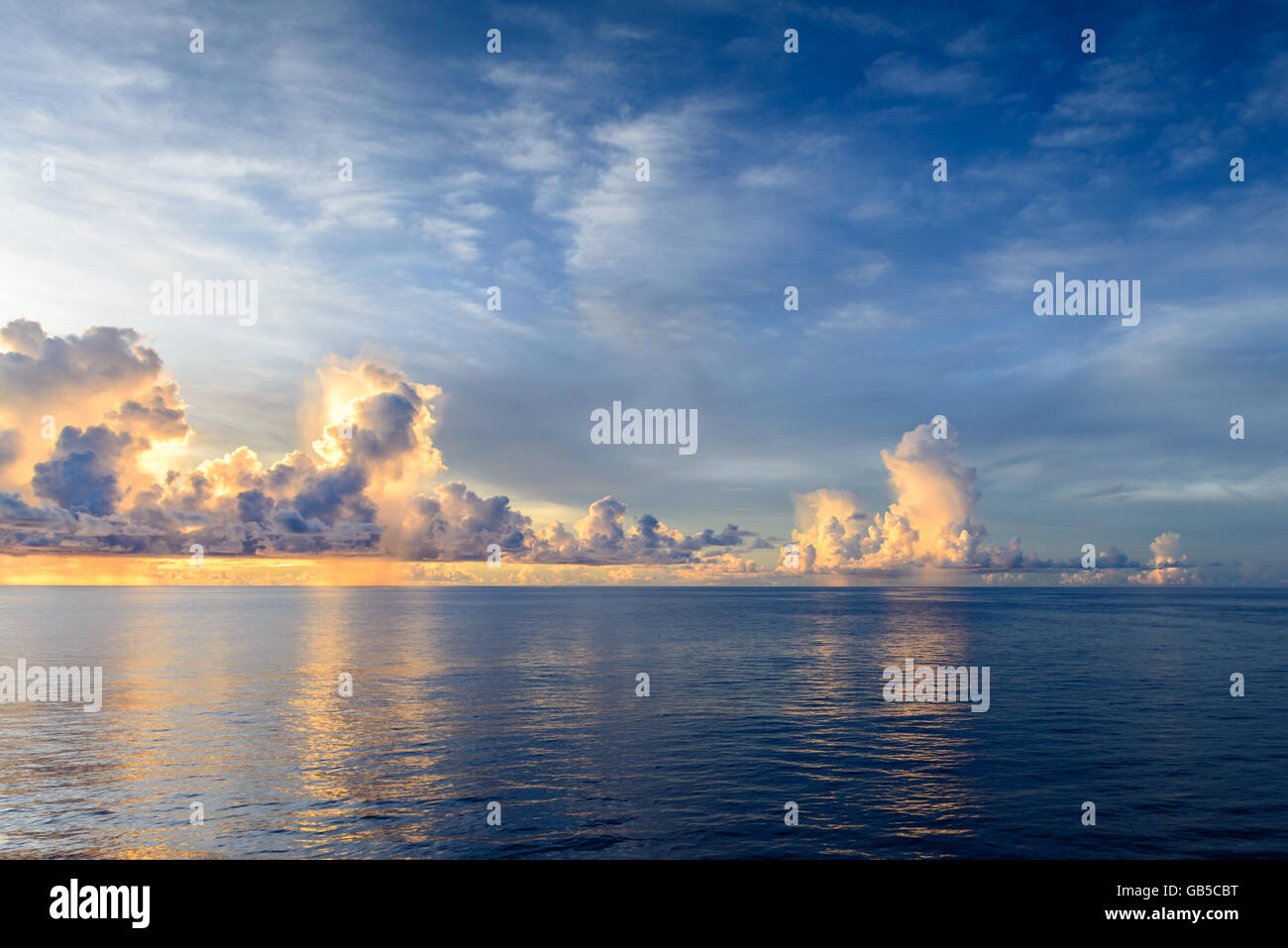 A dark sky with an amazing array of storm clouds with calm seas. Image ...