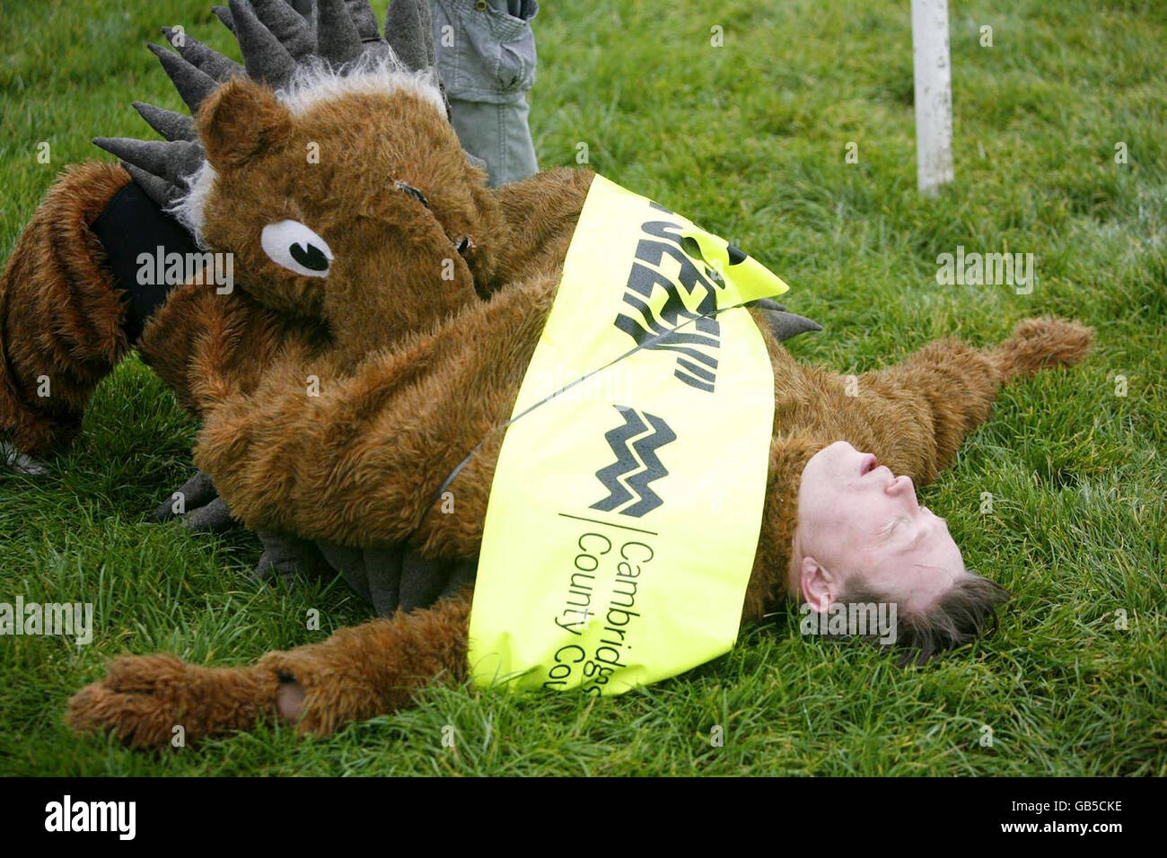 An exhausted mascot lies down after competing in the 10th annual Mascot ...