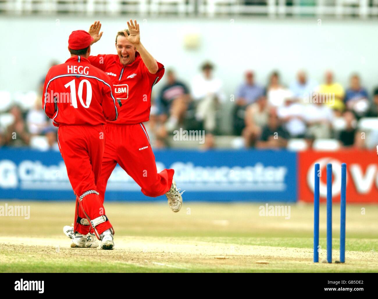 Lancashire bowler Chris Schofield celebrates with wicket keeper Warren ...