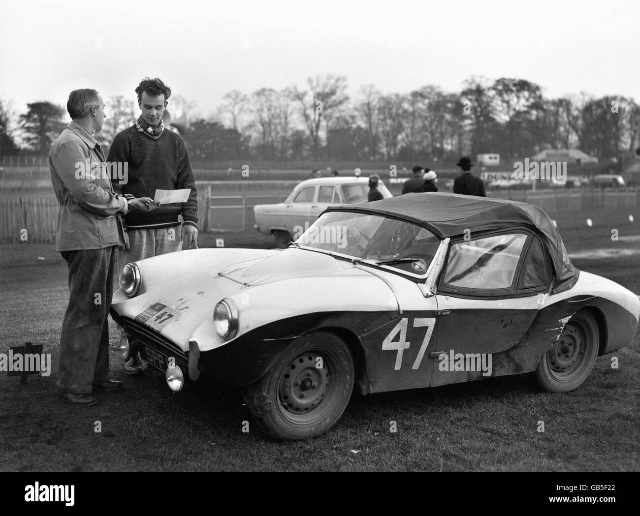 Air Vice-Marshall Donald Bennett (left) and W. Banks wait to check-in ...