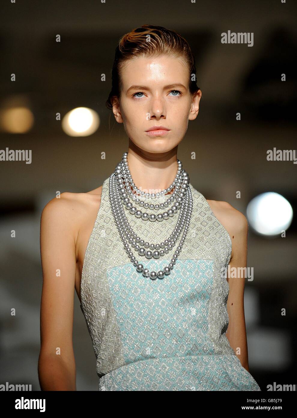 A model wears a creation by Richard Nicoll during London Fashion Week ...