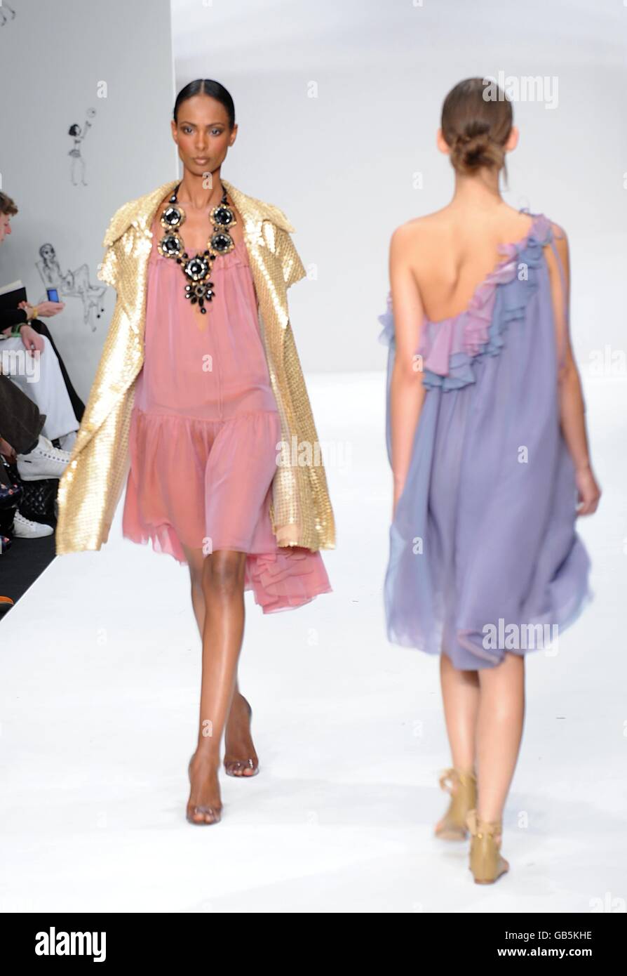 London Fashion Week - Issa Catwalk Show. A model wears a creation by ...