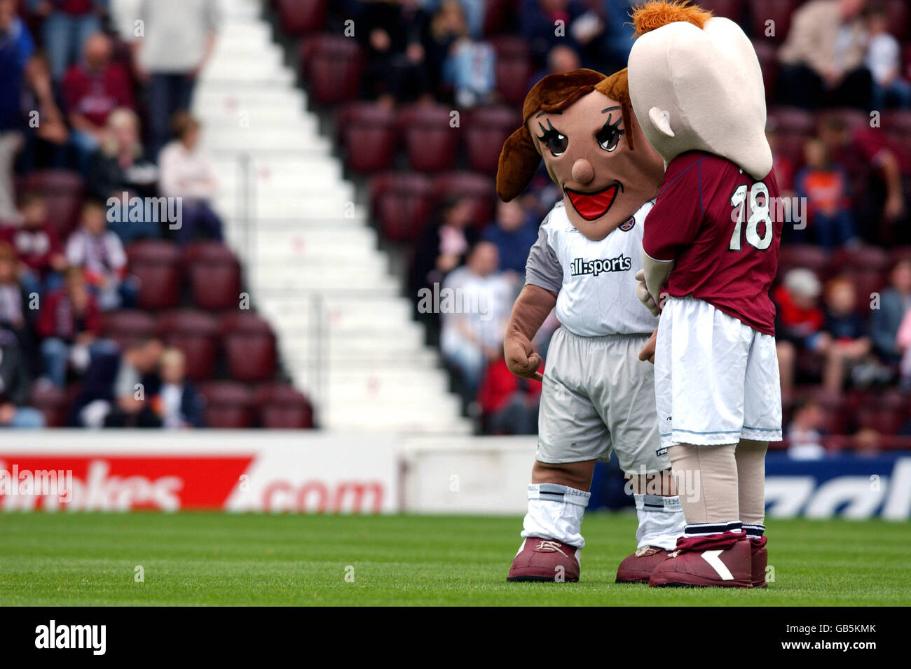 (L-R) Heart Of Midlothian mascot's Jemma Jambo and Hearty Harry have a ...
