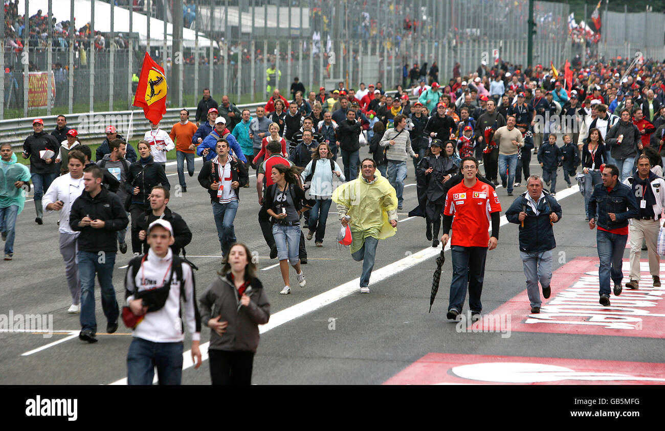 Formula One Motor Racing - Italian Grand Prix - Monza. Fans run down ...