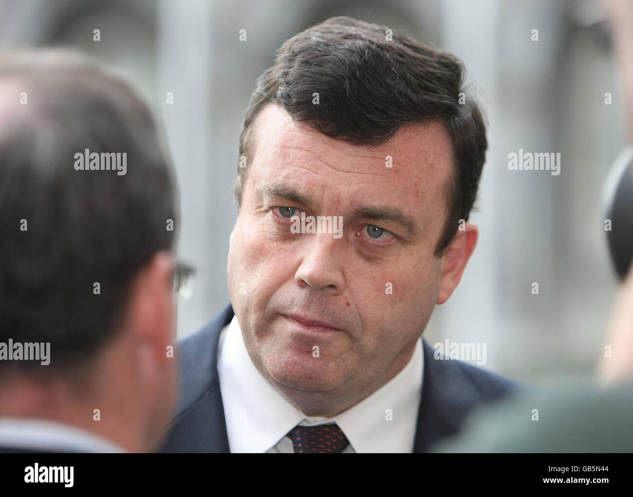 Finance Minister Brian Lenihan speaking to the media as he arrived to ...