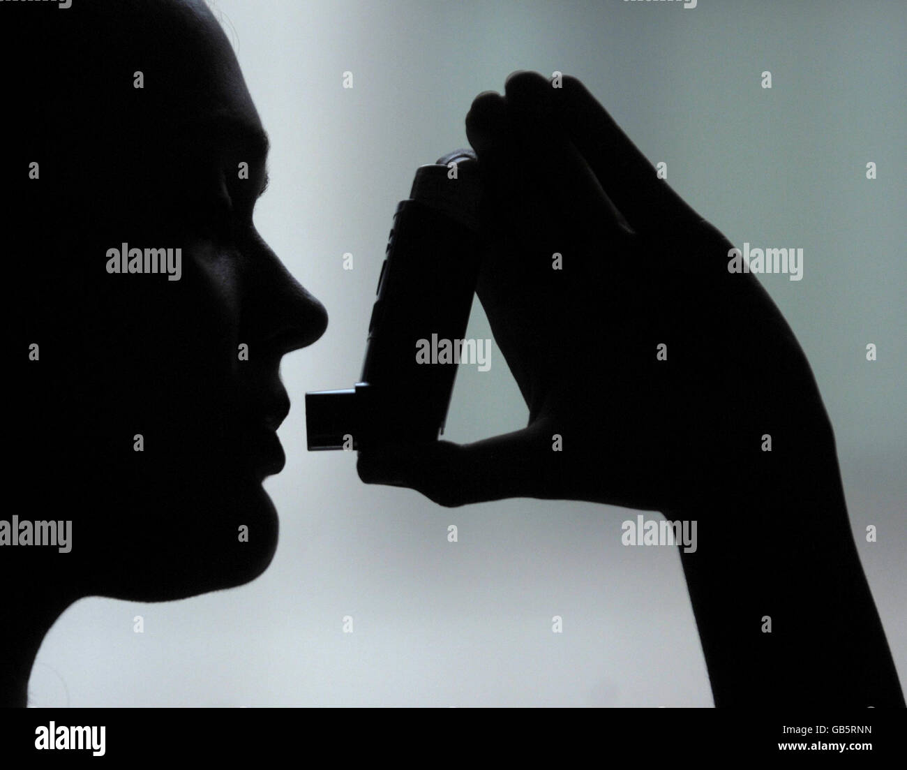 Inhaler stock. General view of a female using an inhaler Stock Photo ...