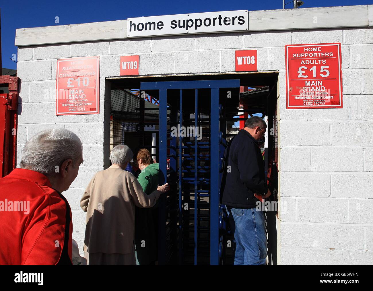 Fans pass through the turnstiles at Accrington Stanley's Fraser Eagle ...