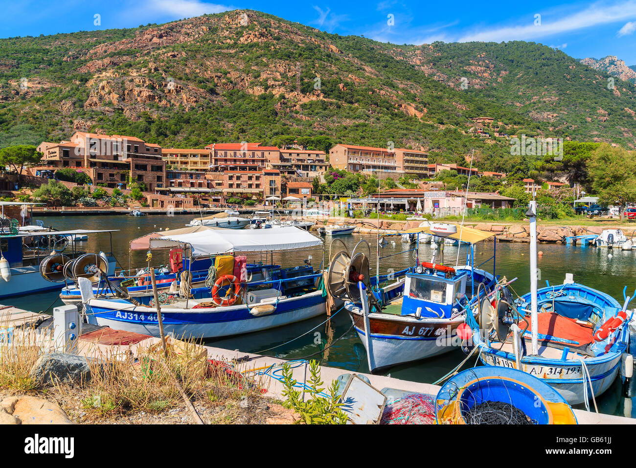 PORTO HARBOUR, CORSICA ISLAND - JUN 27, 2015: colourful fishing boats ...