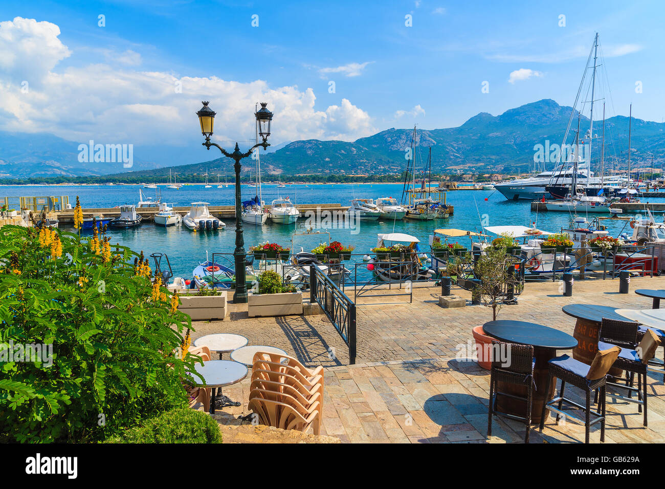 CALVI, CORSICA ISLAND - JUN 29, 2015: chairs and tables of a restaurant ...