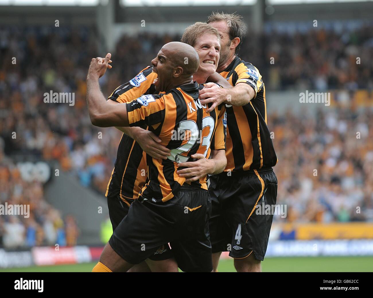 Hull City's Michael Turner (centre) celebrates scoring the first goal ...