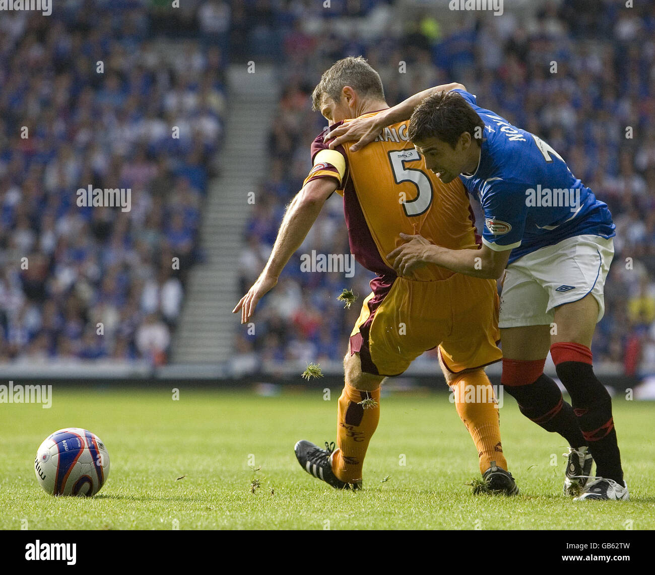 Rangers' Nacho Novo gets around Motherwell's Stephen Craigan during the ...
