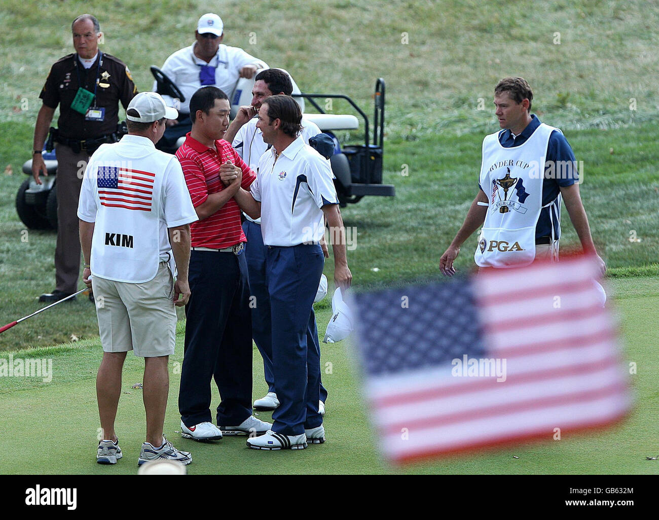USA's Anthony Kim consoles Europe's Sergio Garcia on the 15th during ...
