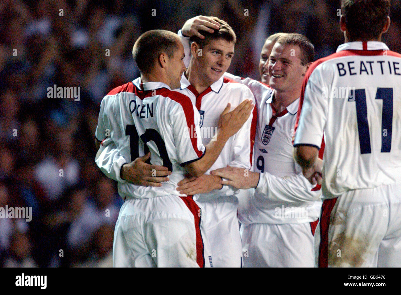 Englands wayne celebrates scoring the goal with michael owen hi-res ...