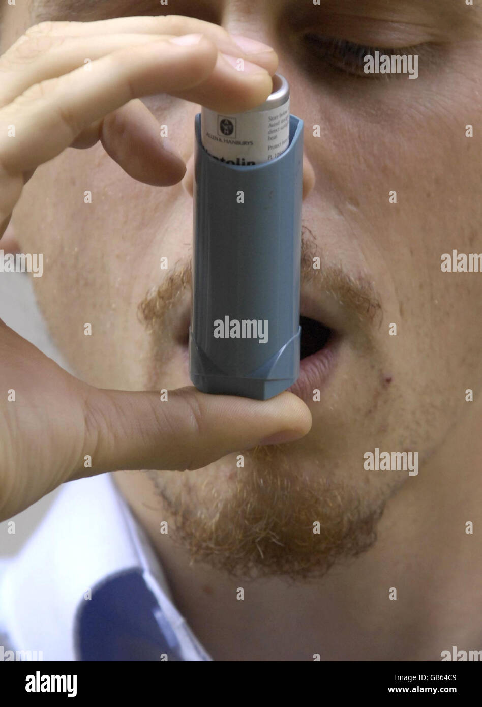 Inhaler stock. Stock picture of a male using an inhaler Stock Photo - Alamy