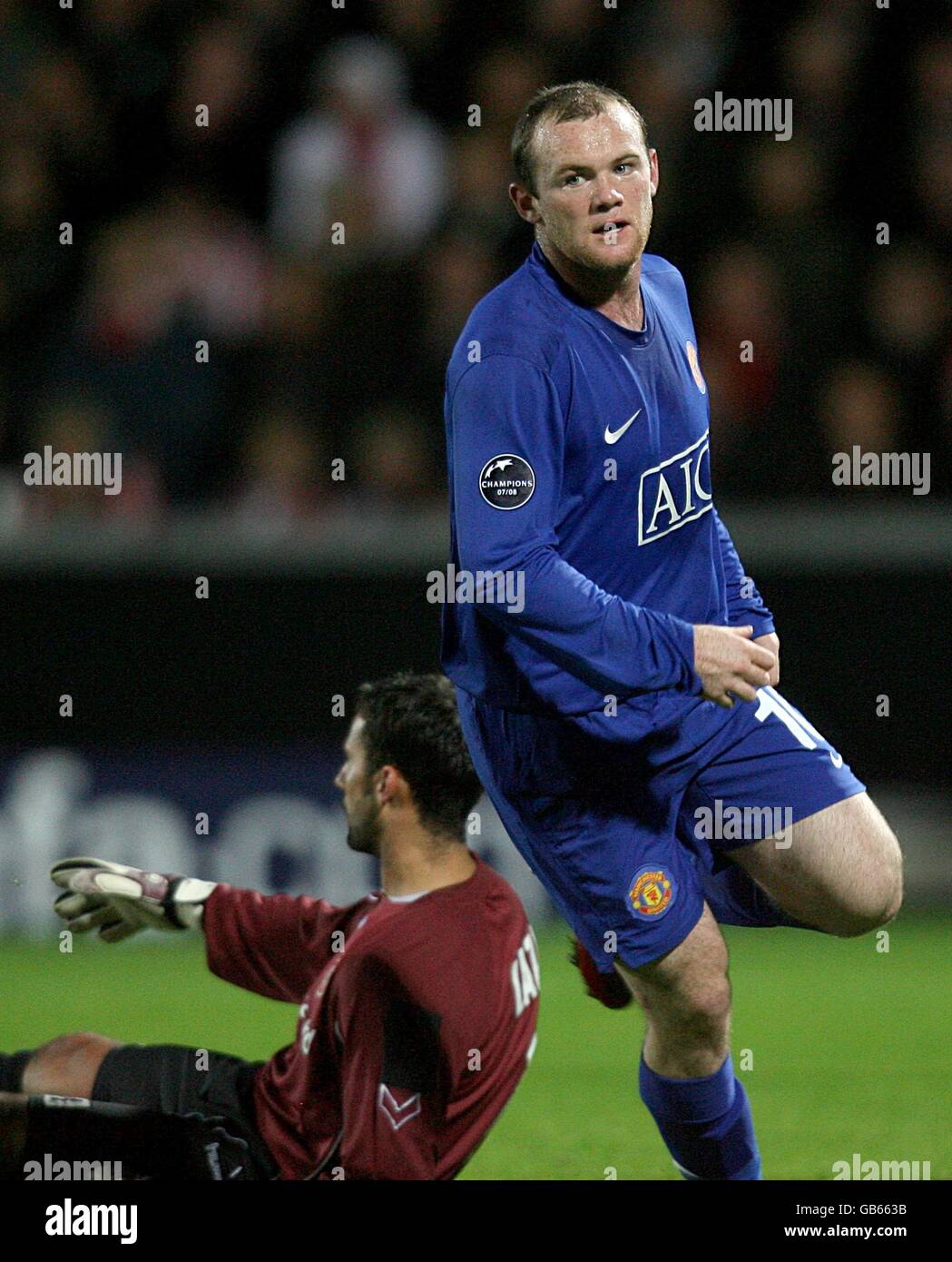 Manchester Wayne Rooney scores the first goal past Aab Aalborg's ...