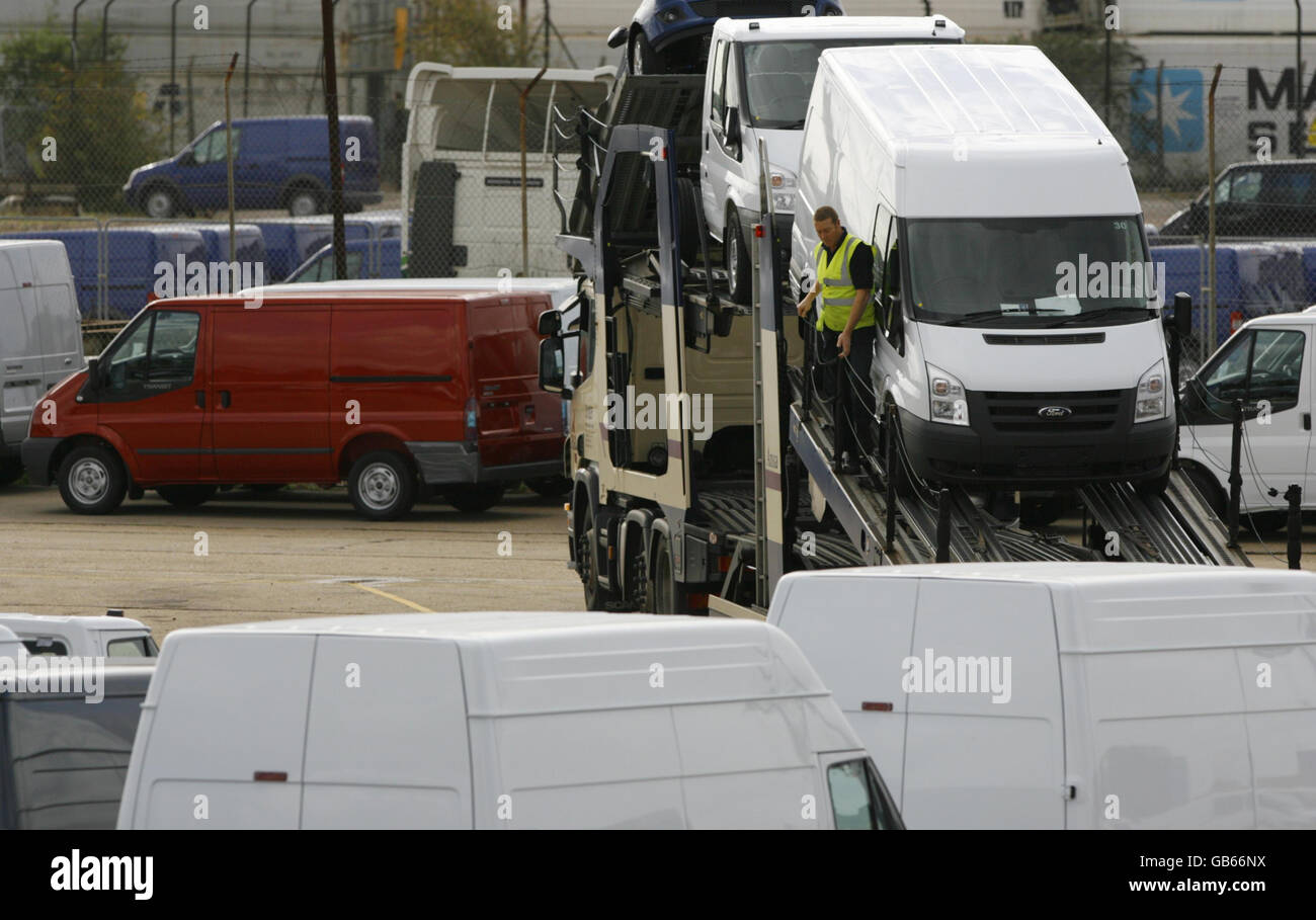 Ford Transit vans awaiting export at Southampton Docks are loaded onto ...