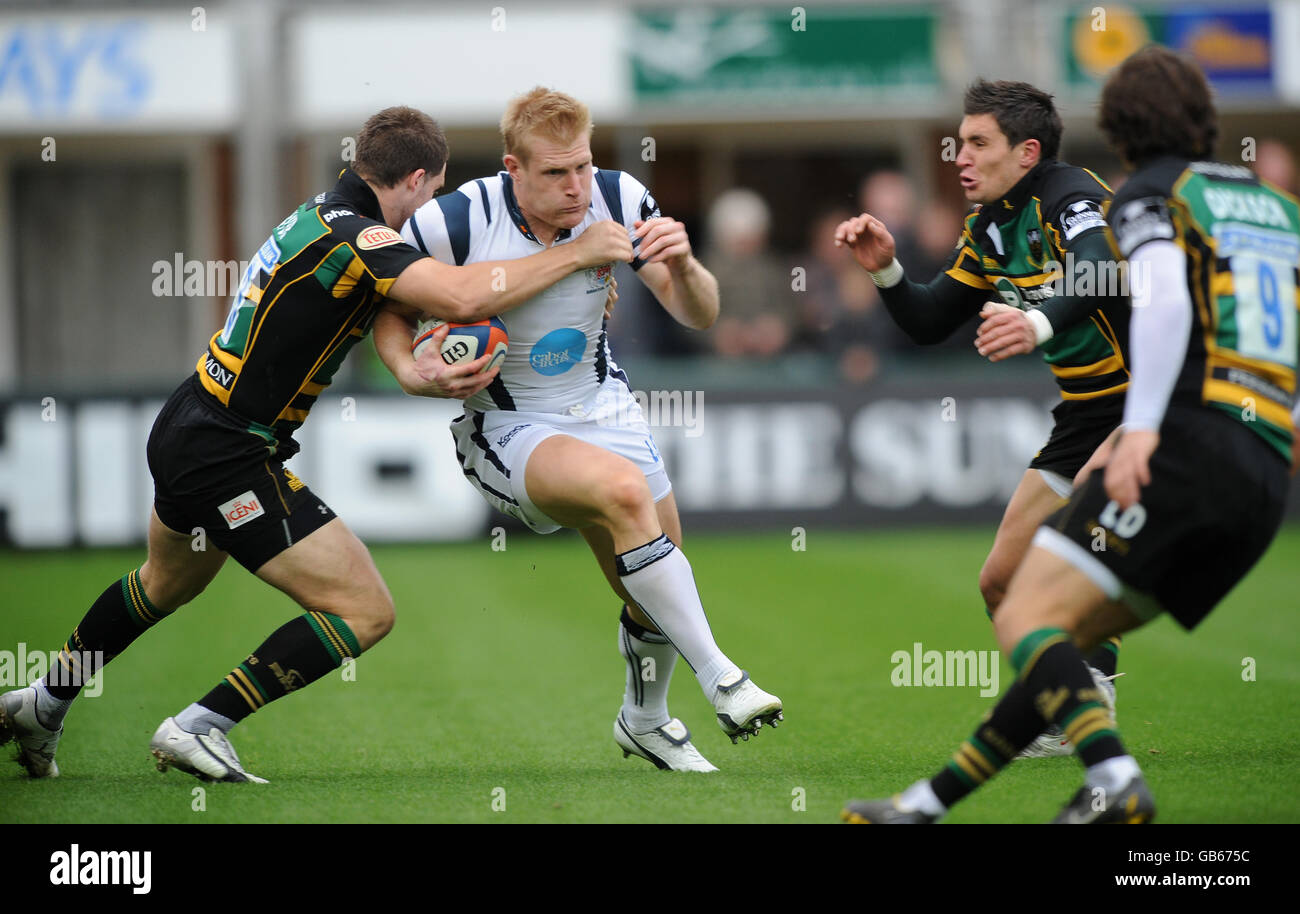 Northampton Saints' Chris Mayor tackles Bristol Rugby's Lee Robinson ...