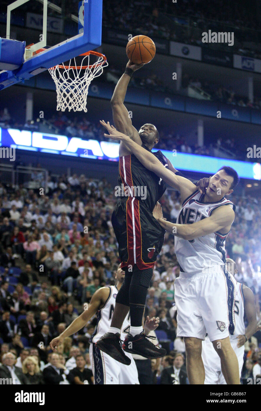 Miami Heat's Dwayne Wade dunks to score despite pressure from New ...