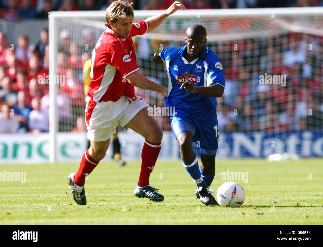Nottingham Forest's Gareth Taylor and Derby County's Pablo Mills battle ...