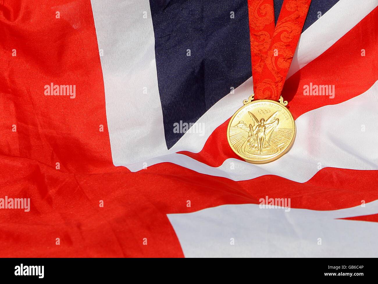 A gold medal rests on a British flag during the Team GB homecoming ...