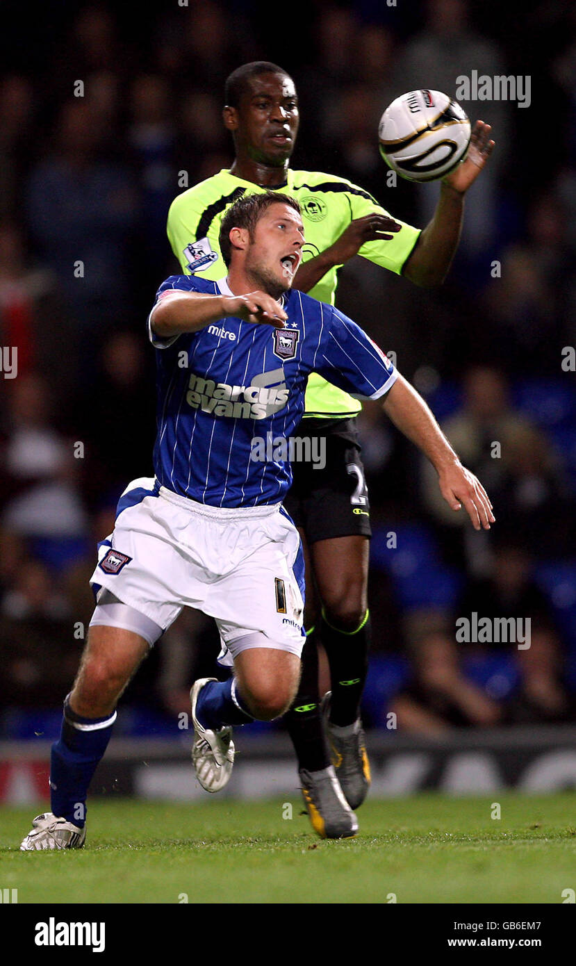 Ipswich Town's David Norris (front) and Wigan Athlectic's Olivier Kapo ...