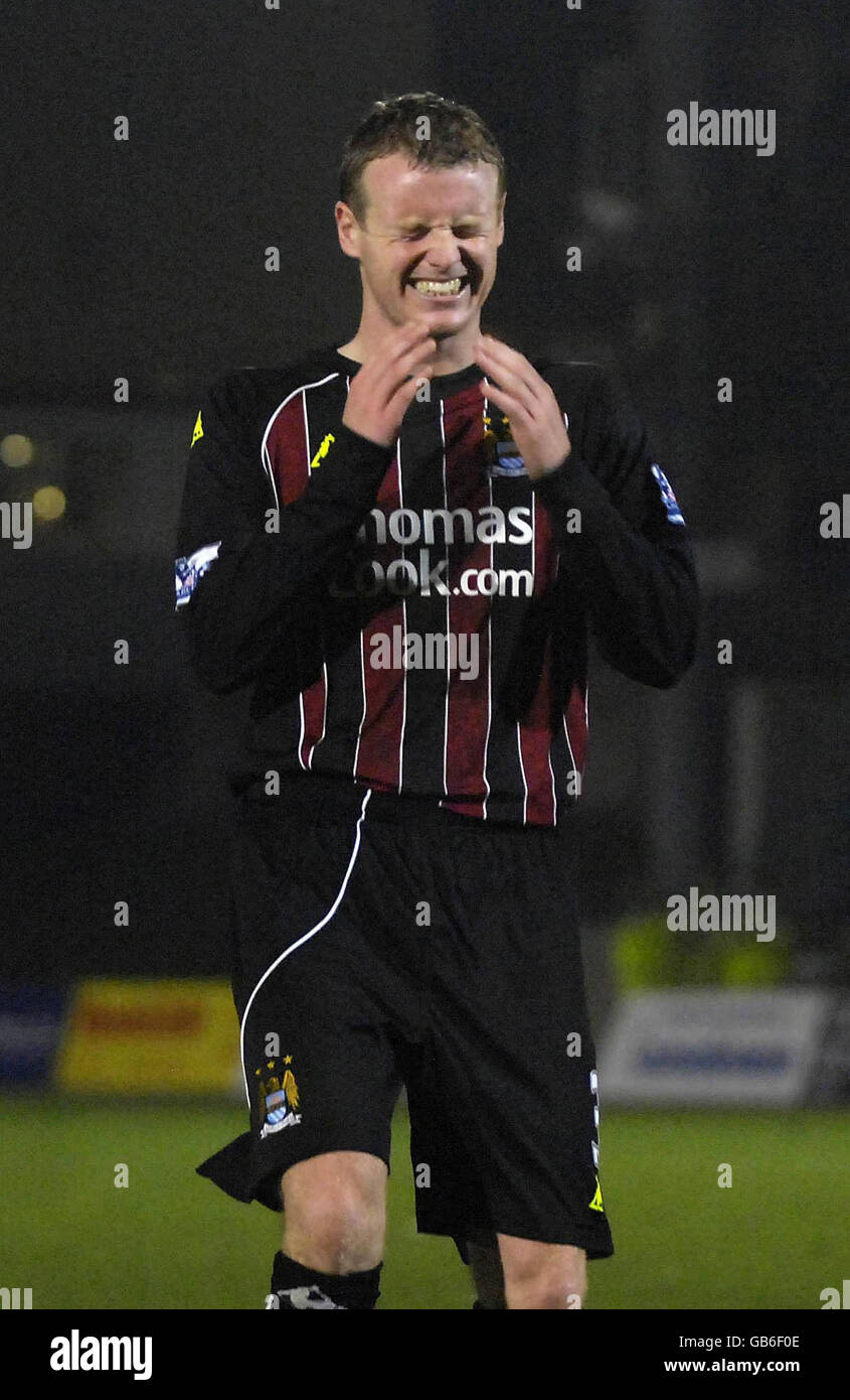 Manchester City's Michael Ball reacts after missing from the spot ...