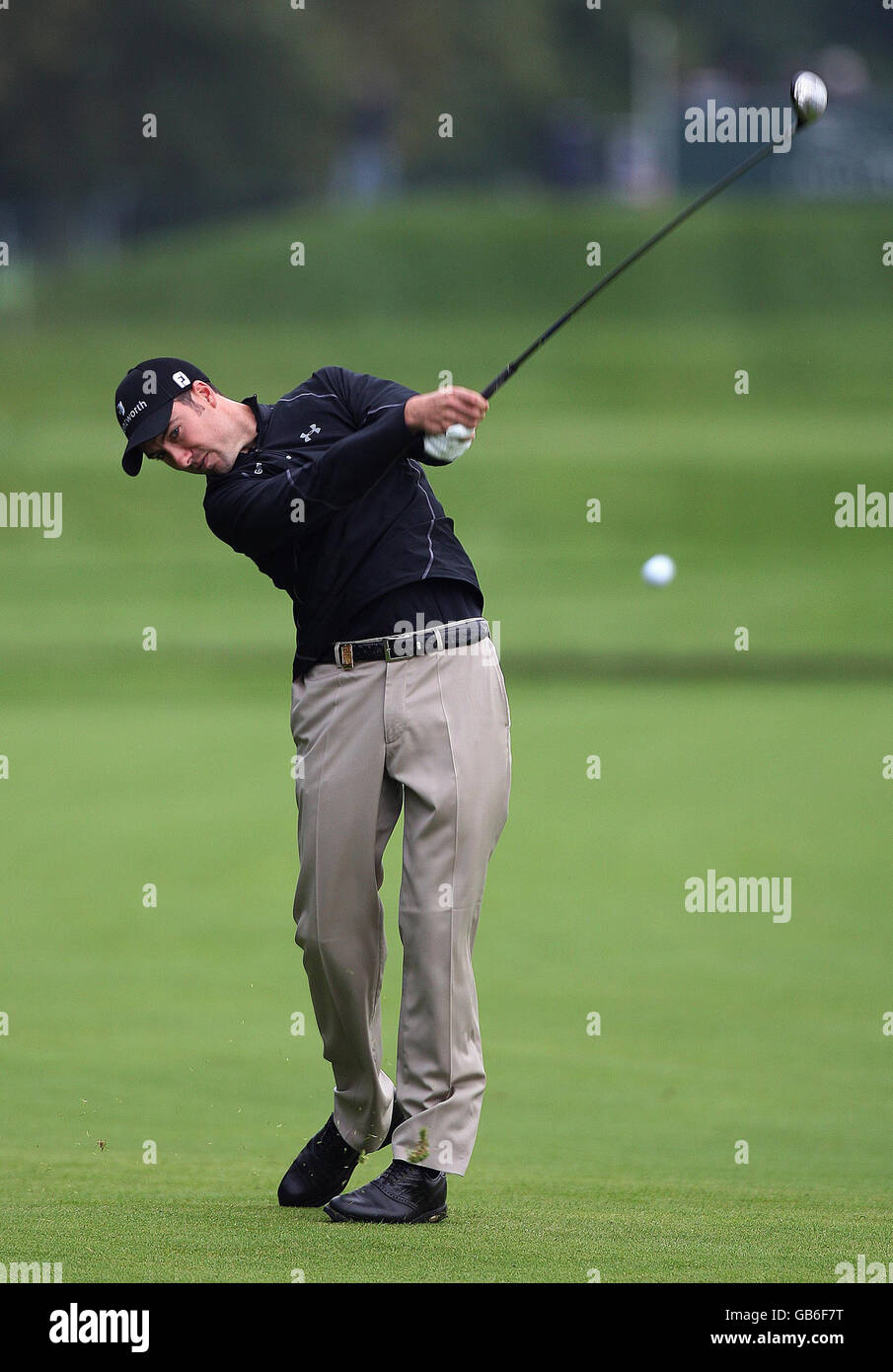 England's Ross Fisher plays his 2nd shot on the 15th fairway during the ...