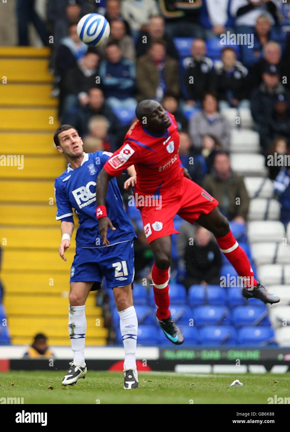 Birmingham City's Stuart Parnaby (left) and Queens Park Rangers's ...