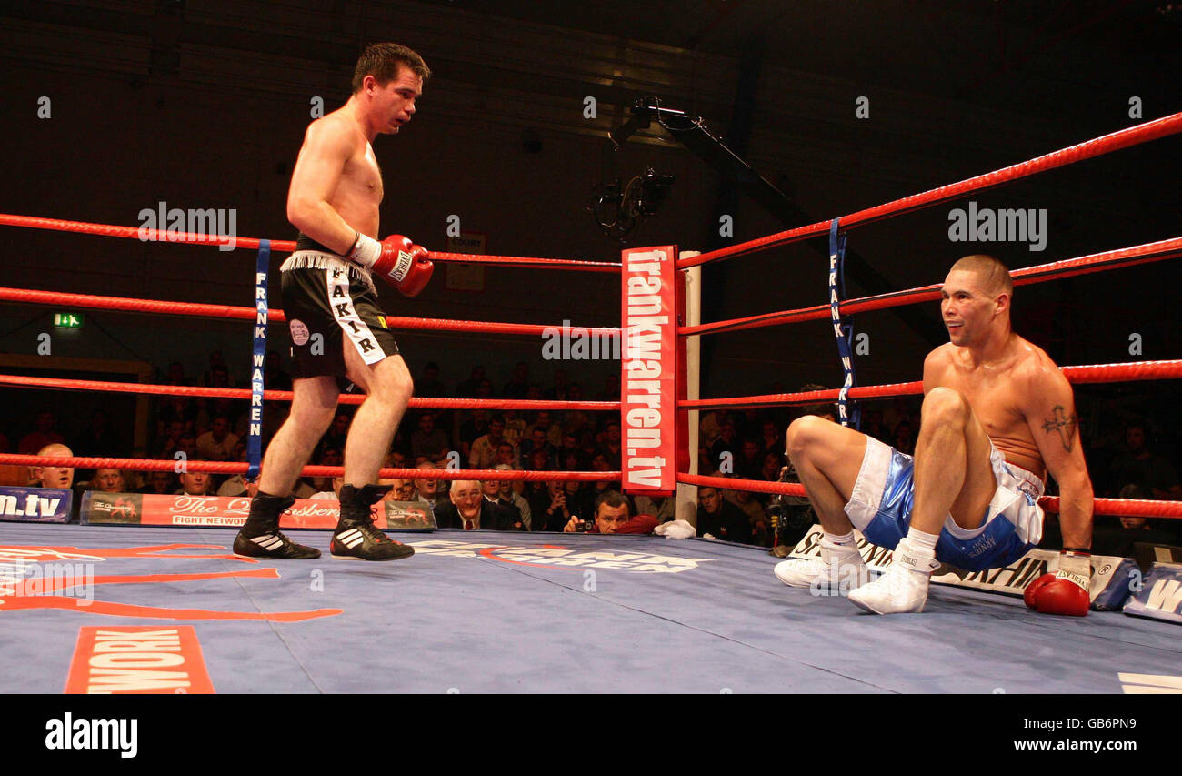 Tony Bellew (right) is knocked down by Jevgenijs Andrejevs during their ...