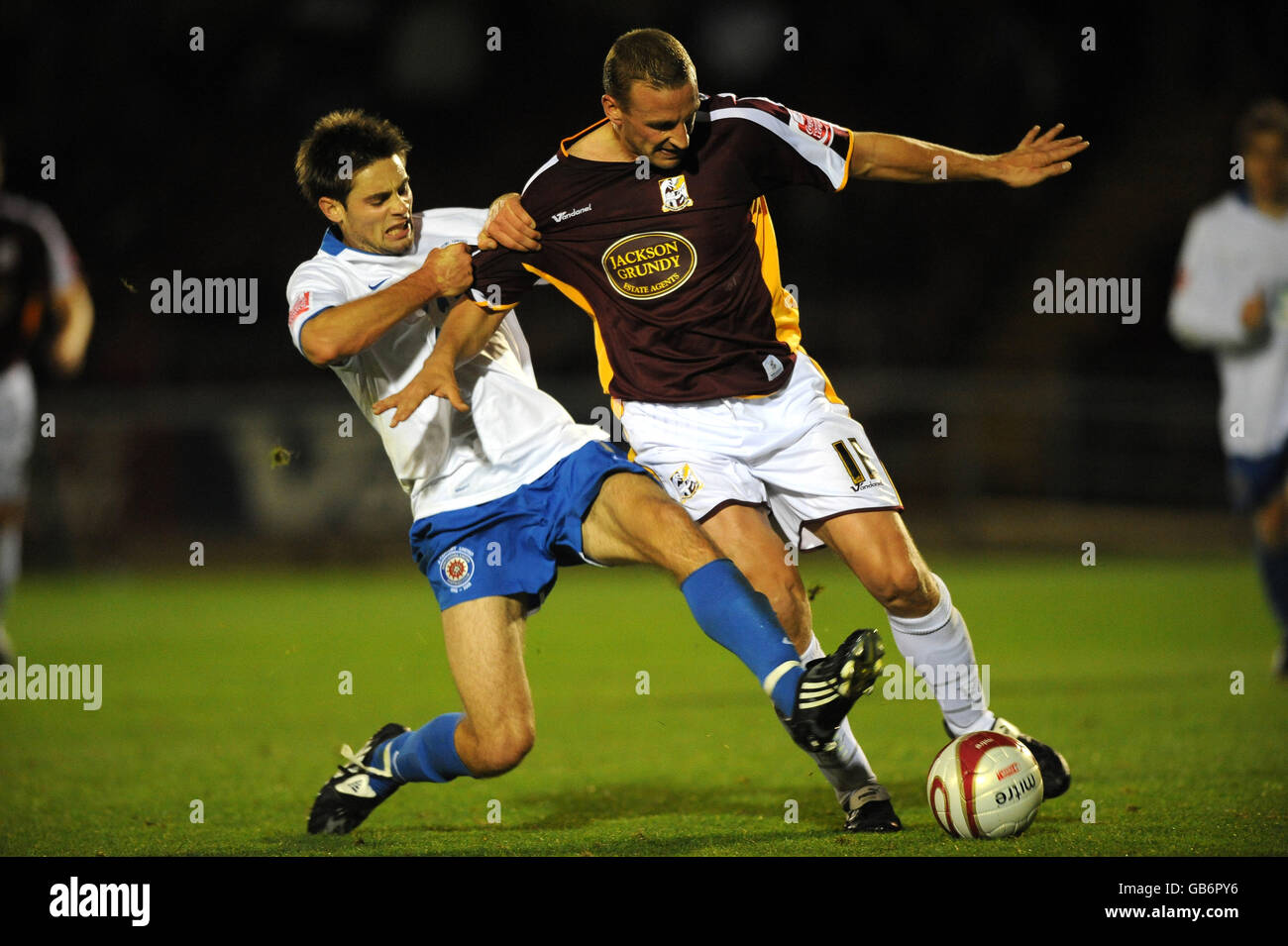 Northampton Town's Andy Holt and Hartlepool United's Ritchie Jones ...