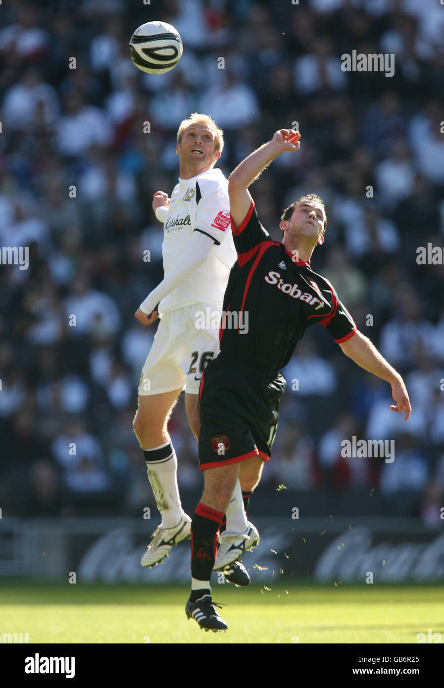 Milton Keynes Dons' Luke Chadwick and Carlisle United's Luke Joyce ...
