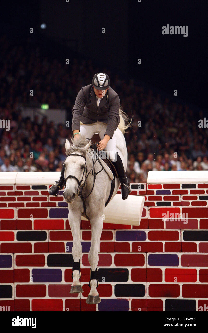 Great Britain's Andrew James riding Presco competes in the Puissance on ...
