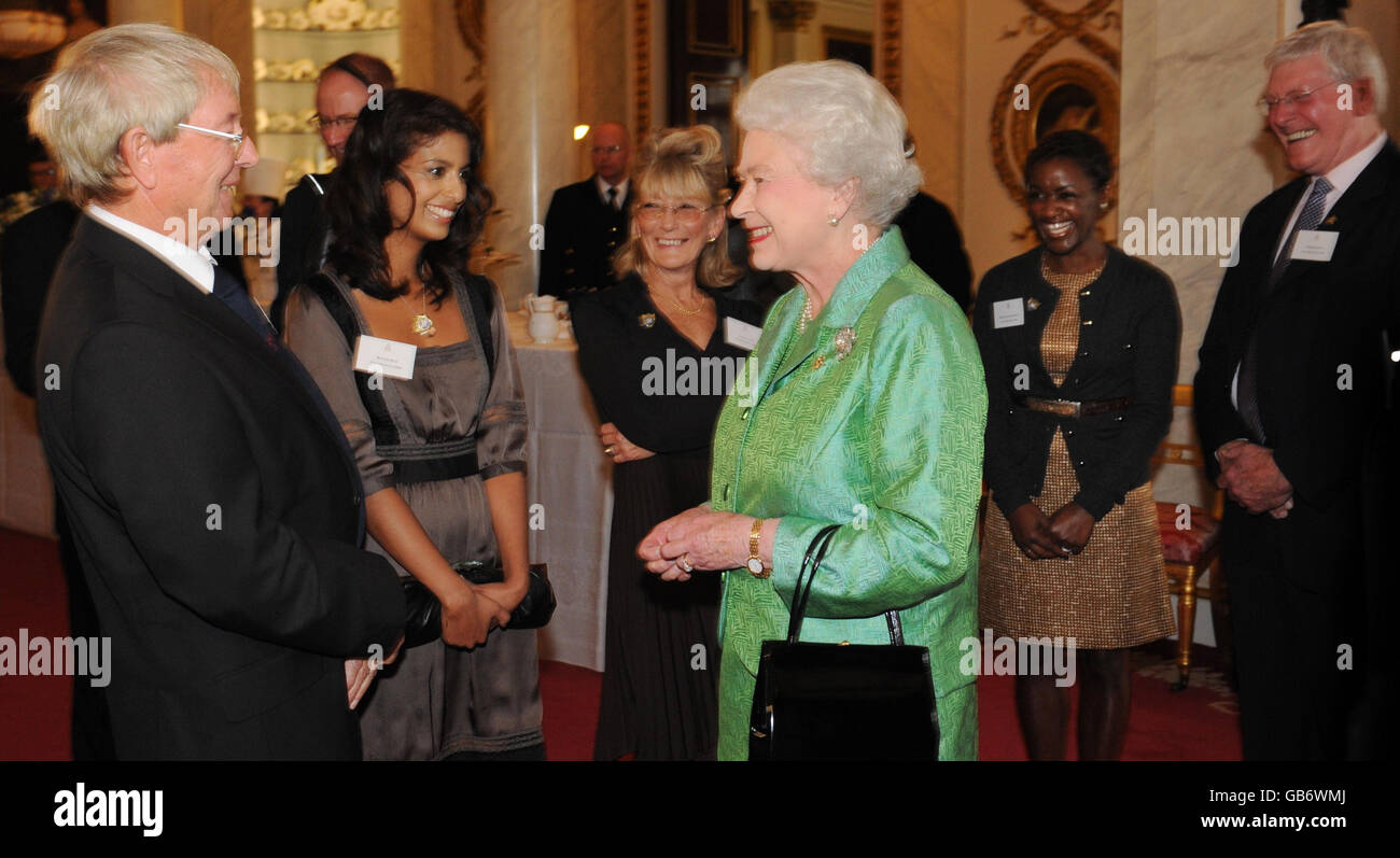 Queen Elizabeth II receives Blue Peter presenters, from left to right ...