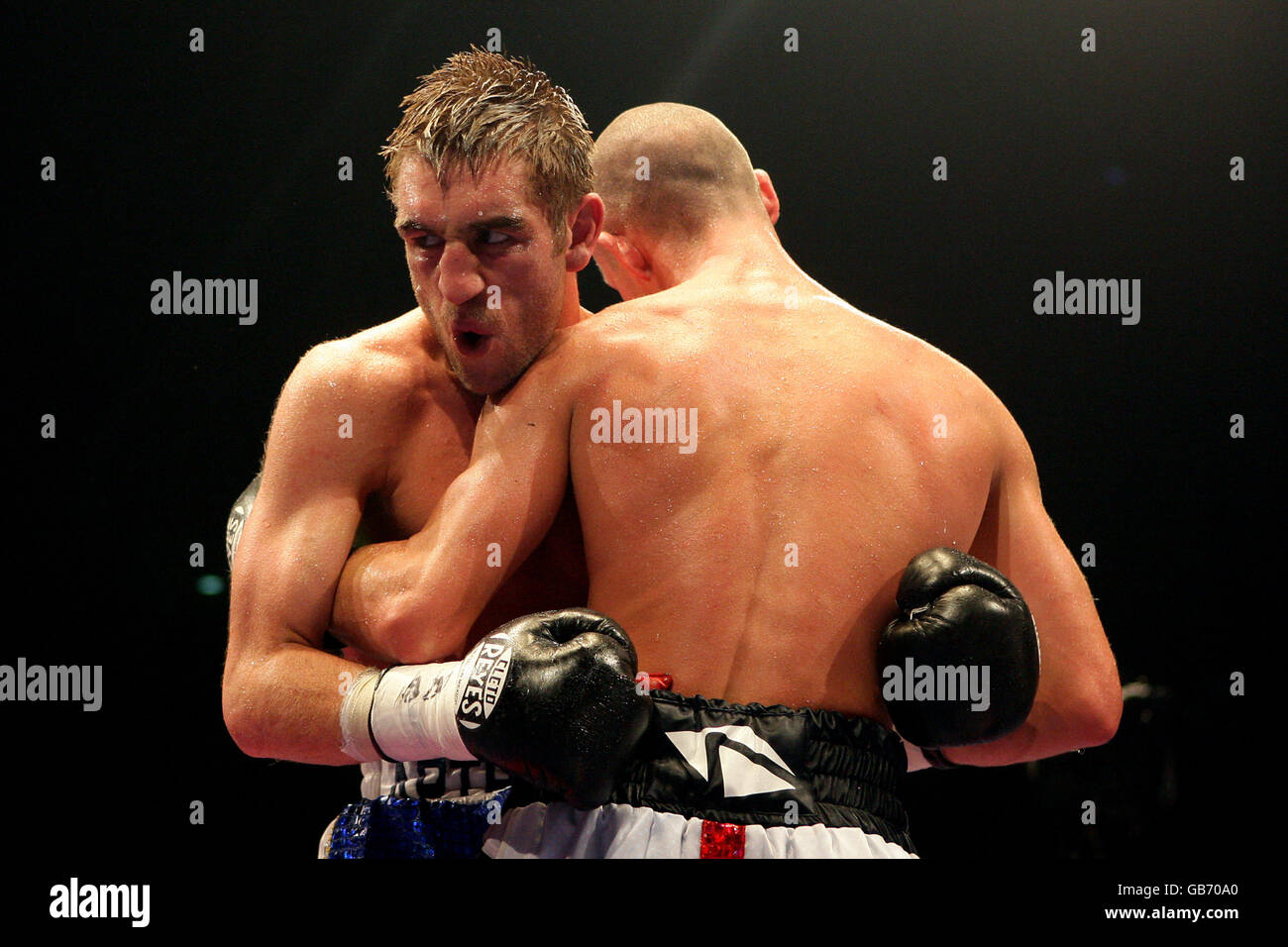 Alex Arthur in action with Nicky Cook during their WBO Super ...