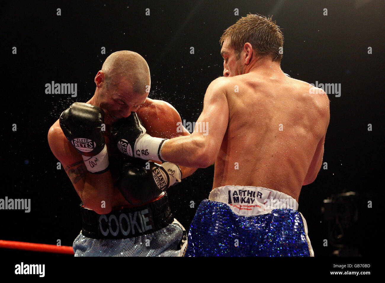Alex Arthur in action with Nicky Cook during their WBO Super ...