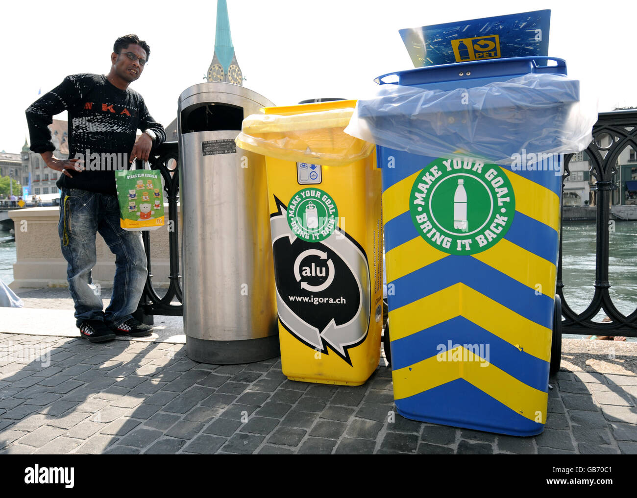 A man poses recycling bins in zurich hi-res stock photography and ...