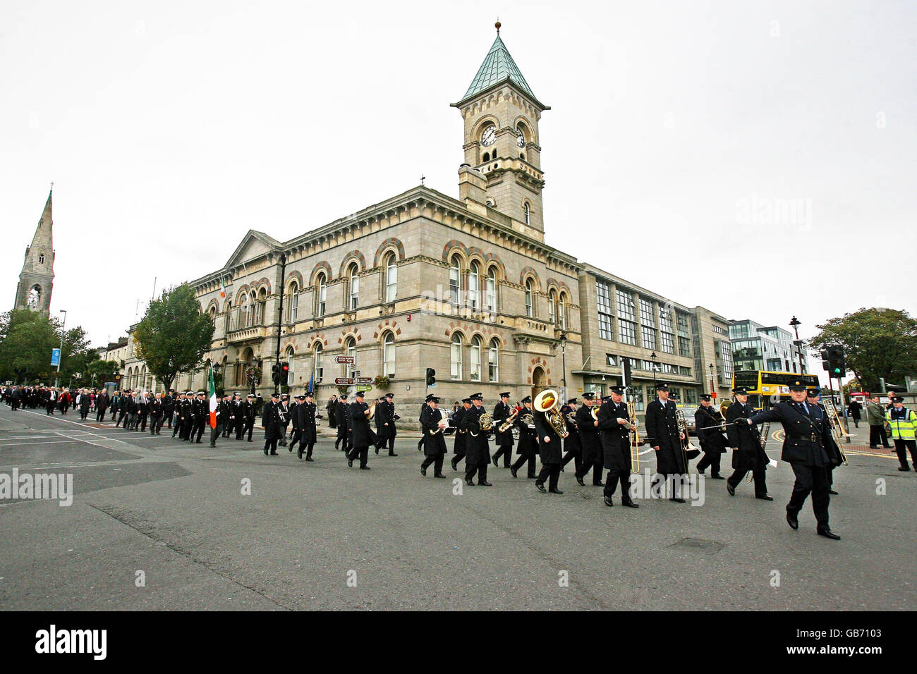 Members of the Garda band march towards the anchor of the RMS Leinster ...