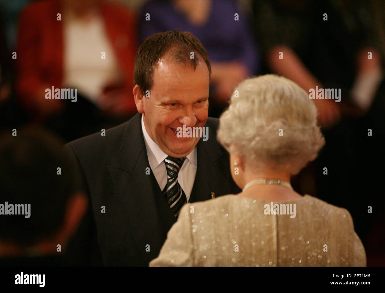 John Harrison is made an MBE by Queen Elizabeth II for services to ...