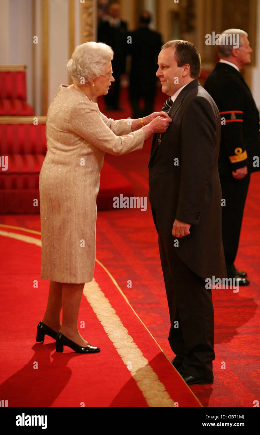John Harrison is made an MBE by Queen Elizabeth II for services to ...