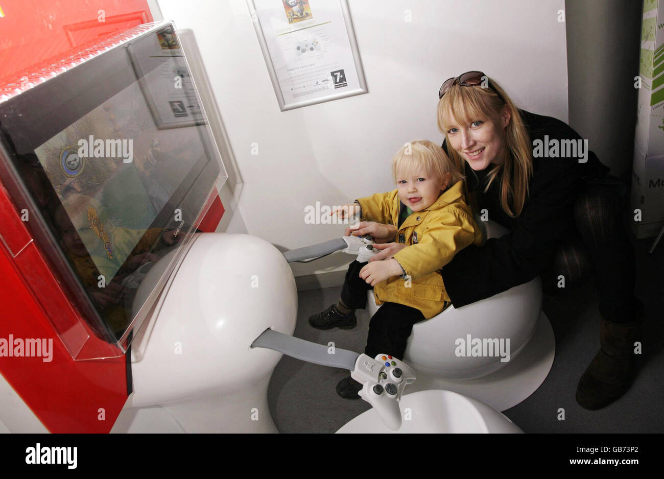 Jade Parfitt and her son playing the video game Kung Fu Panda, during ...