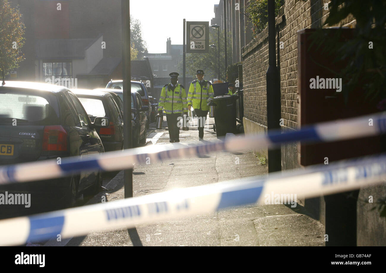 Police officers at a murder scene on the corner of White Hart Street ...