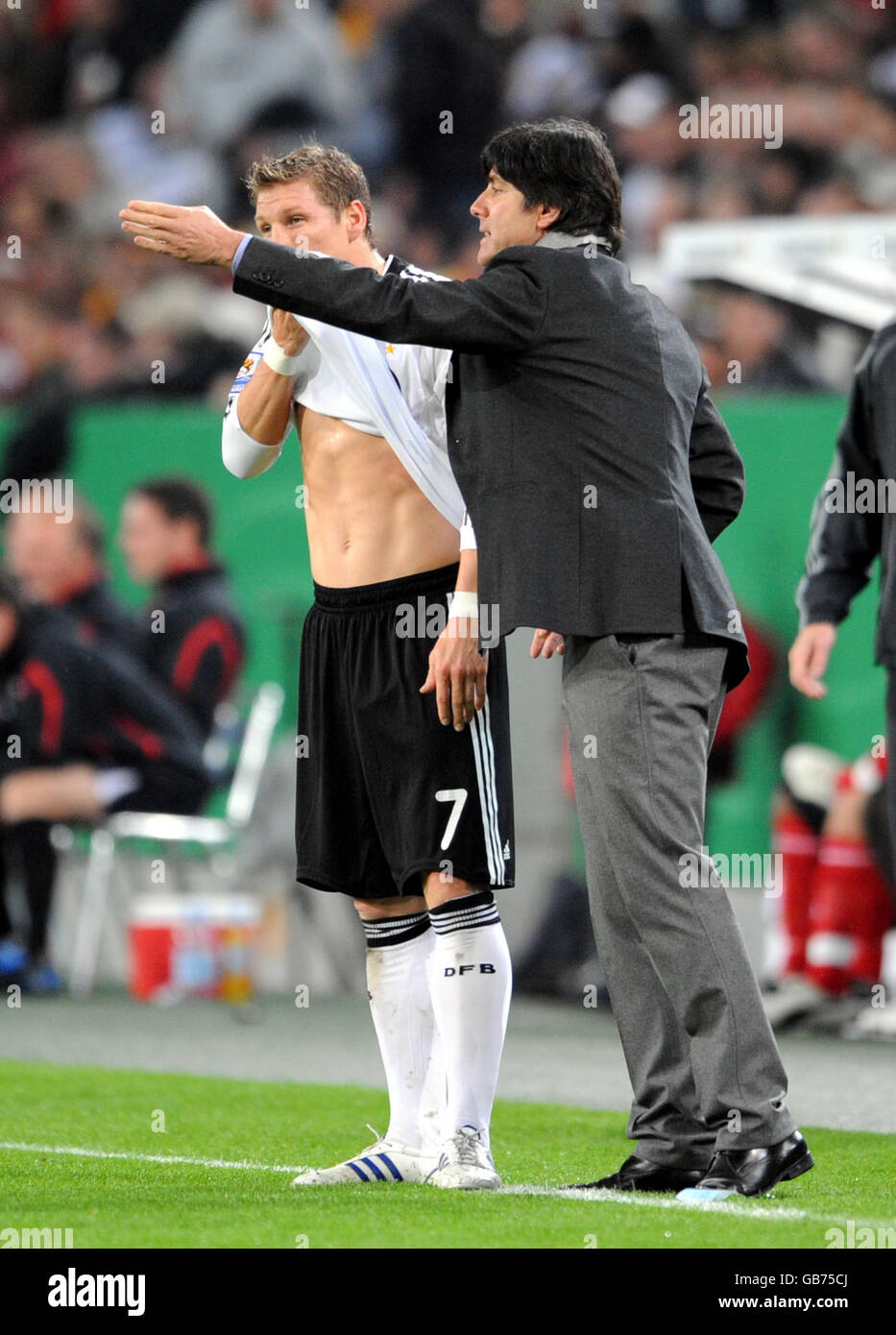 Germany manager joachim low r gives instructions to lukas podolski hi ...