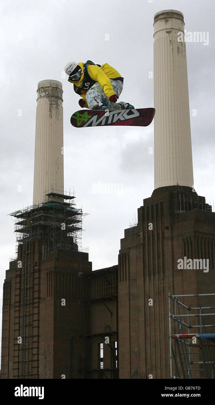 A snowboarder on the ski slope at Battersea power station in London for ...