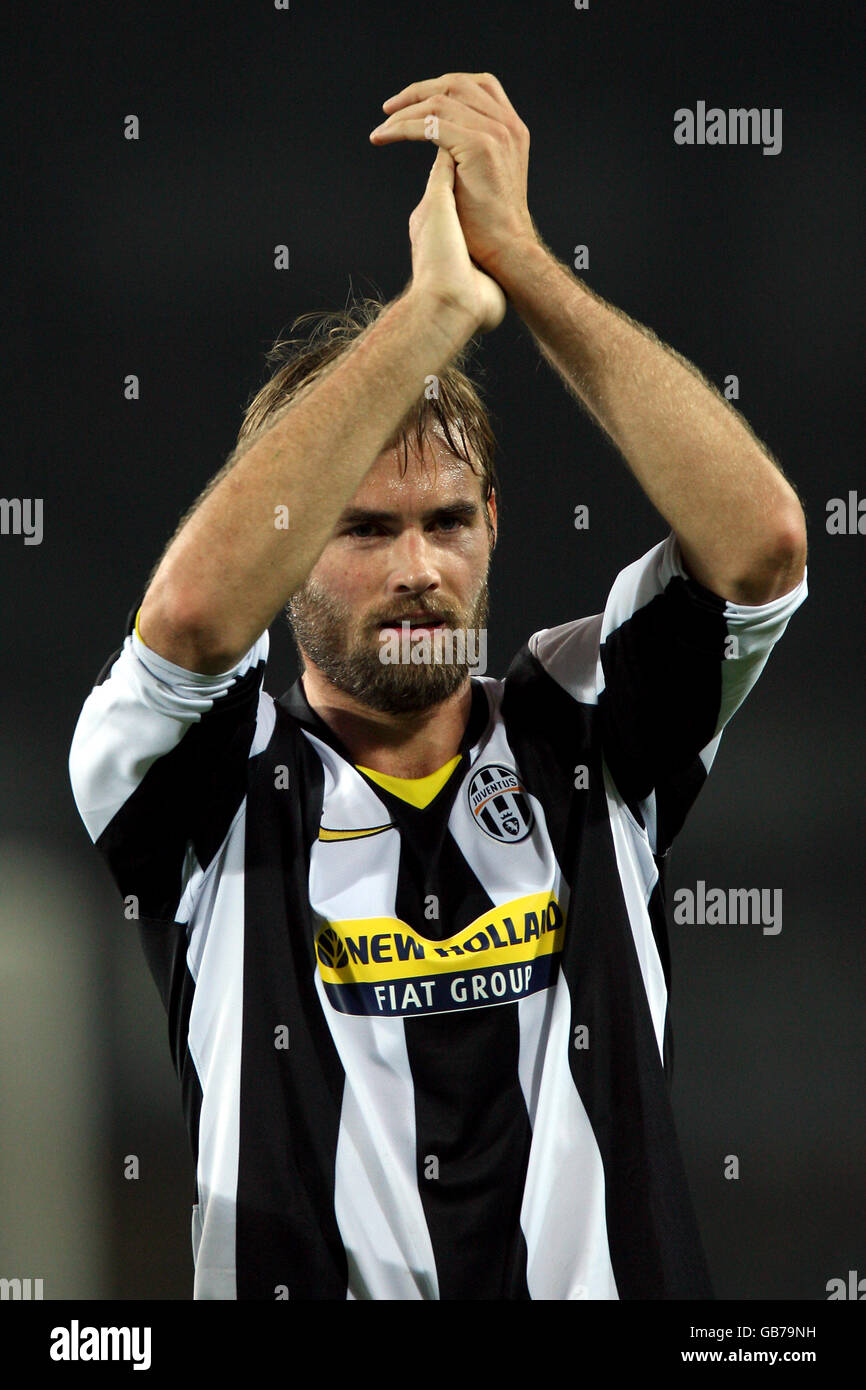 Juventus' Olof Mellberg celebrates their victory at the end of the game ...