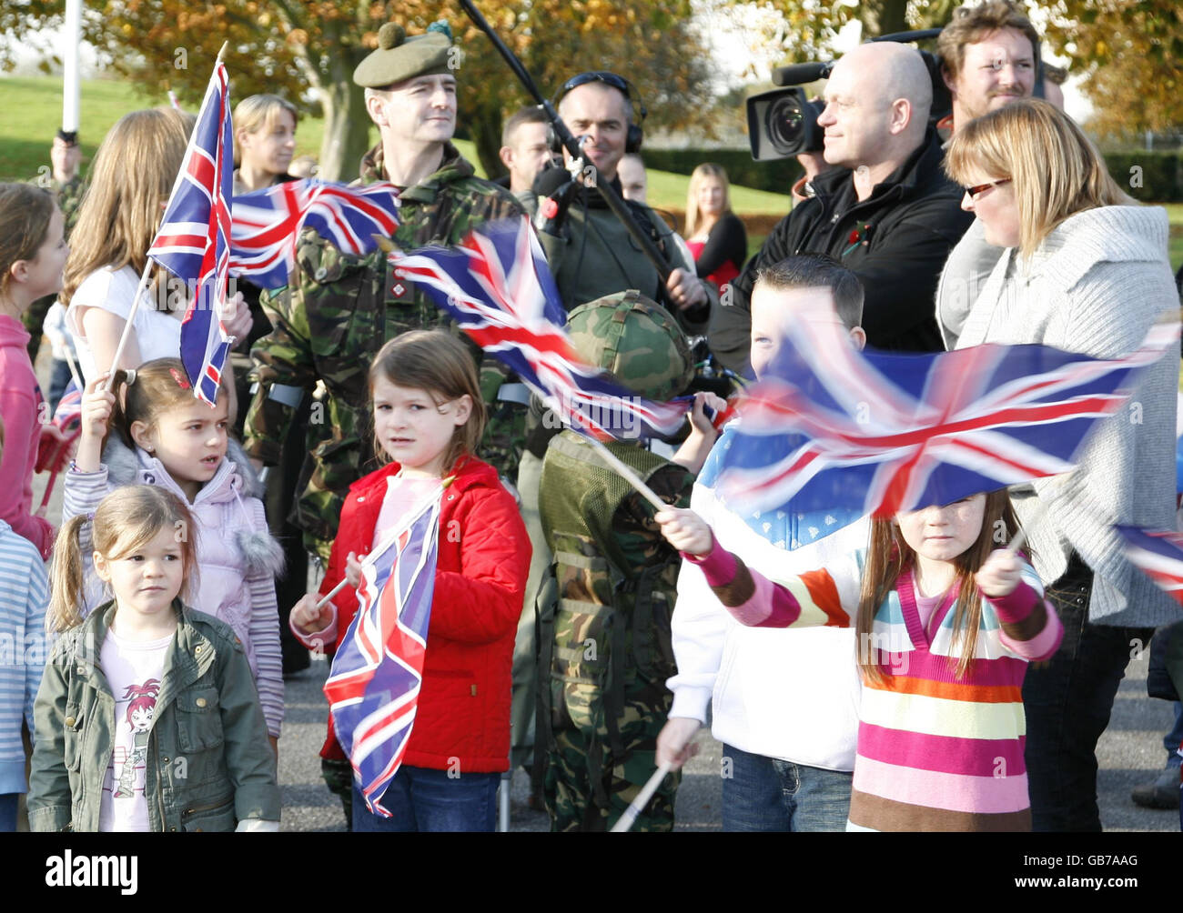 Actor and TV presenter, Ross Kemp, third right, waits with family and ...