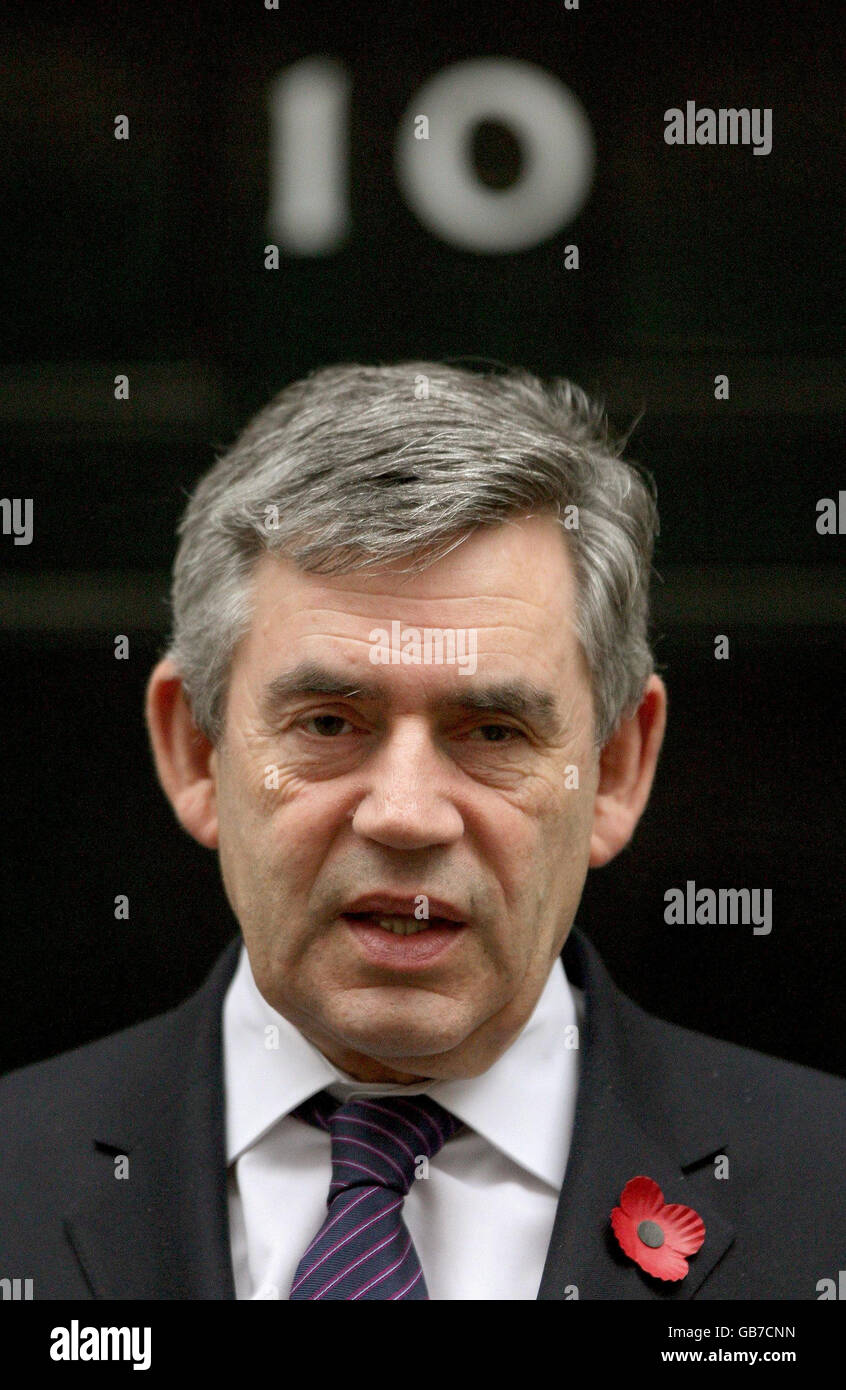 Prime Minister Gordon Brown after he is presented with a poppy from ...