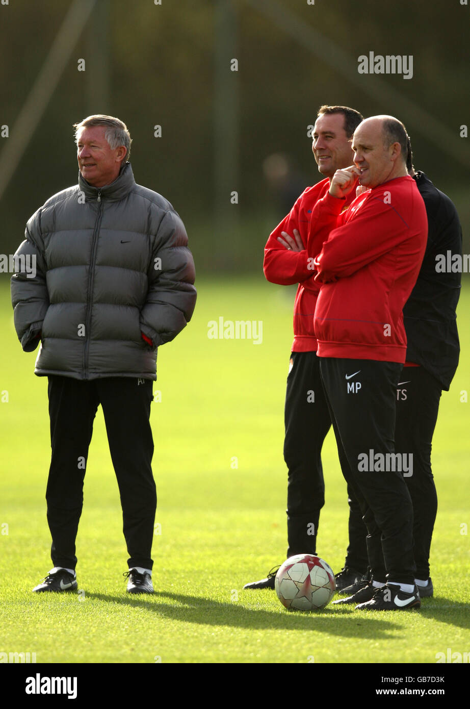 Manchester United's manager Sir Alex Ferguson and his coaching staff ...