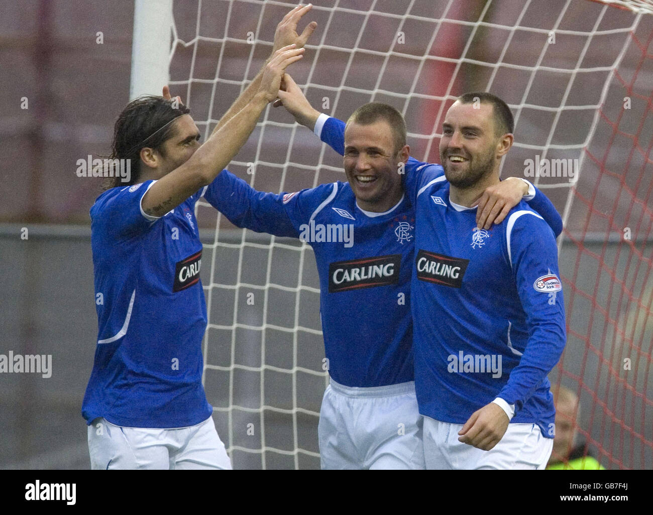 Rangers striker Kris Boyd (right) celebrates with Pedro Mendes (left ...
