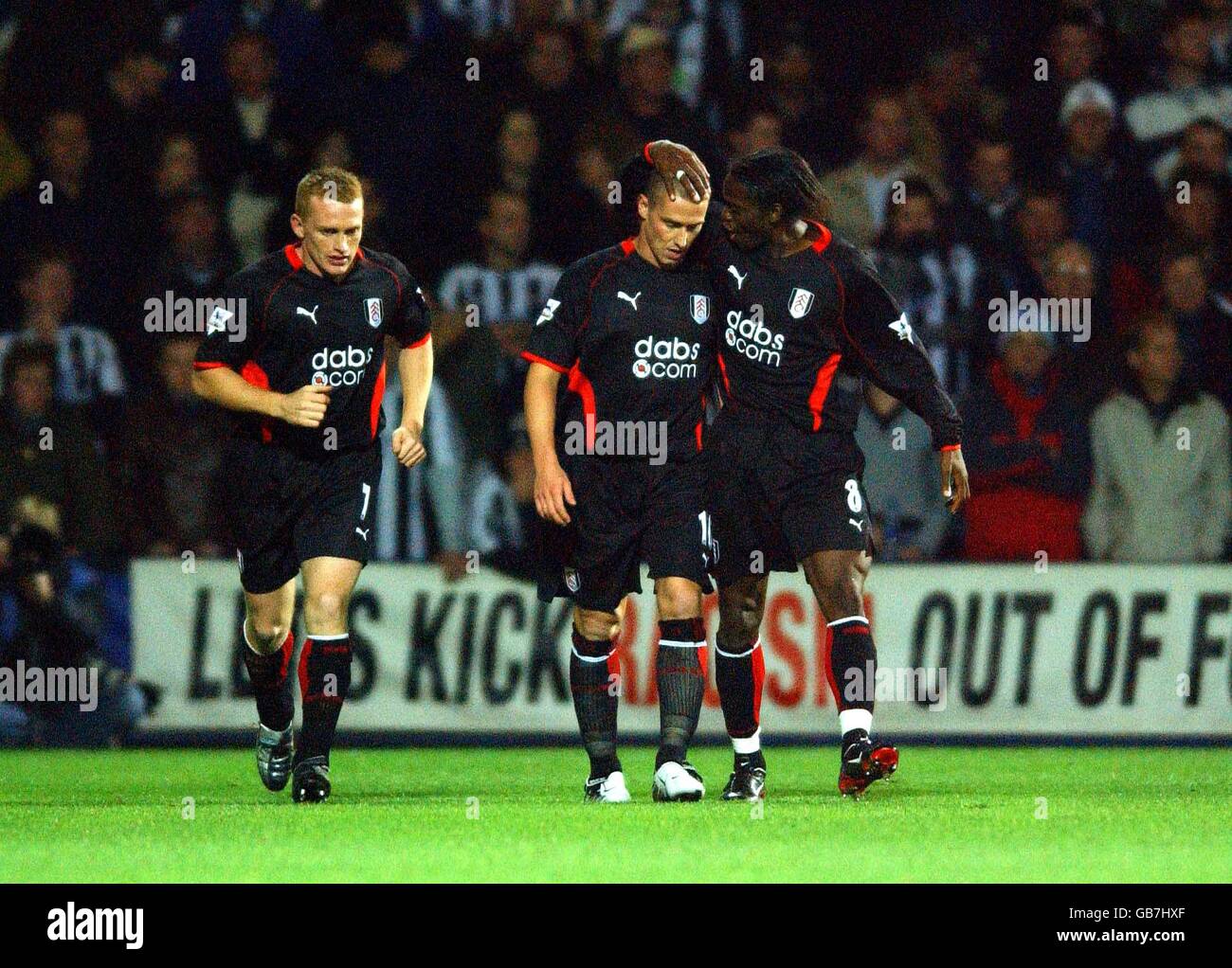 Fulham's Lee Clark (c) celebrates with Louis Saha (r) after scoring the ...