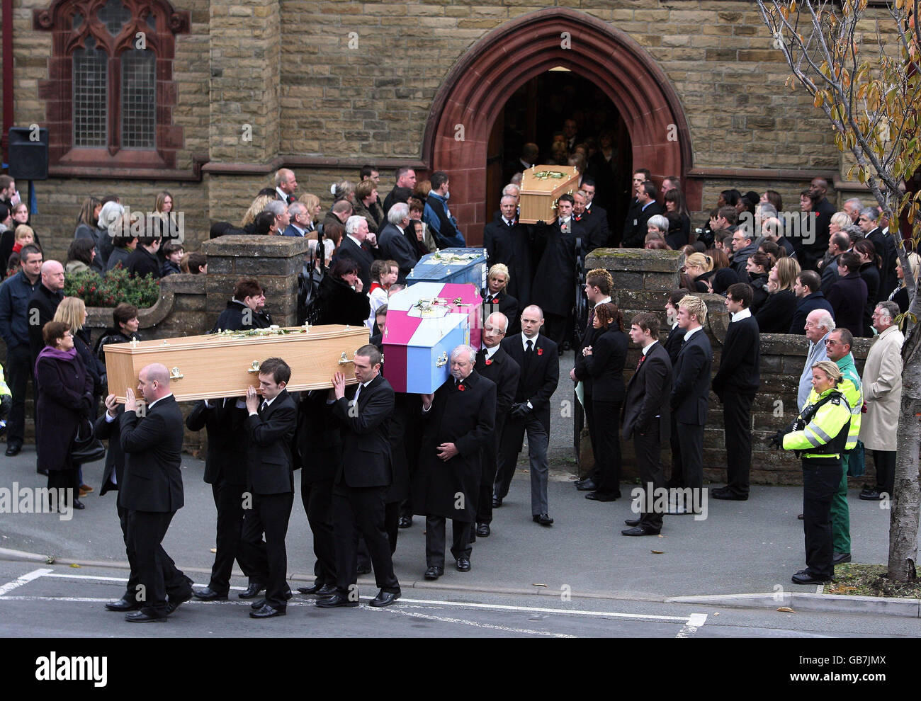 Mourners attend the funeral of David and Michelle Statham and their ...